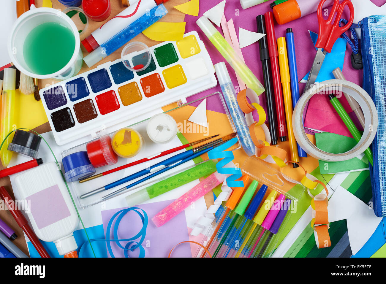 artwork workplace with creative accessories, art tools for painting and ...