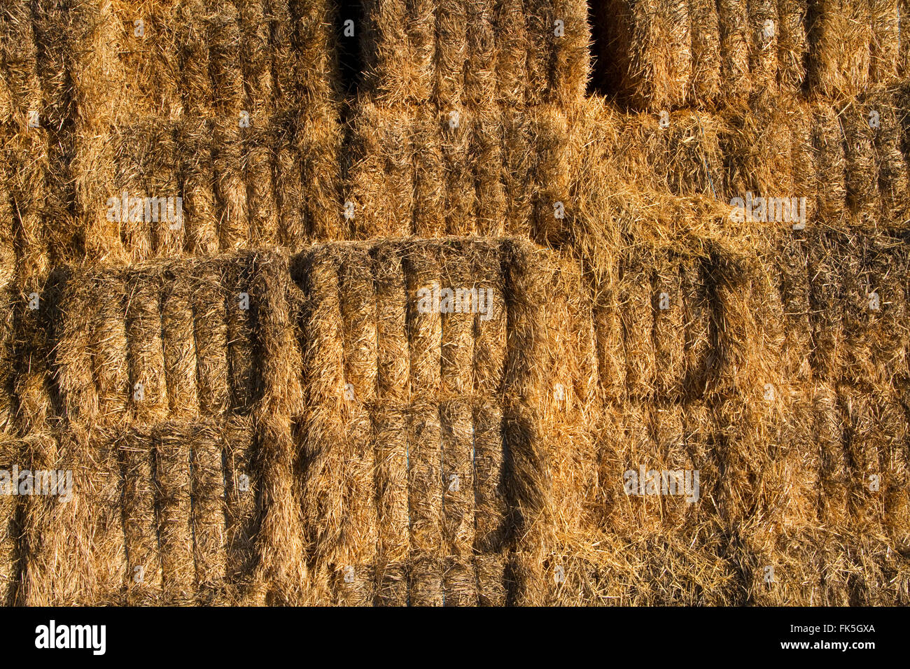 Stacked straw bales make a background, pattern or texture Stock Photo ...