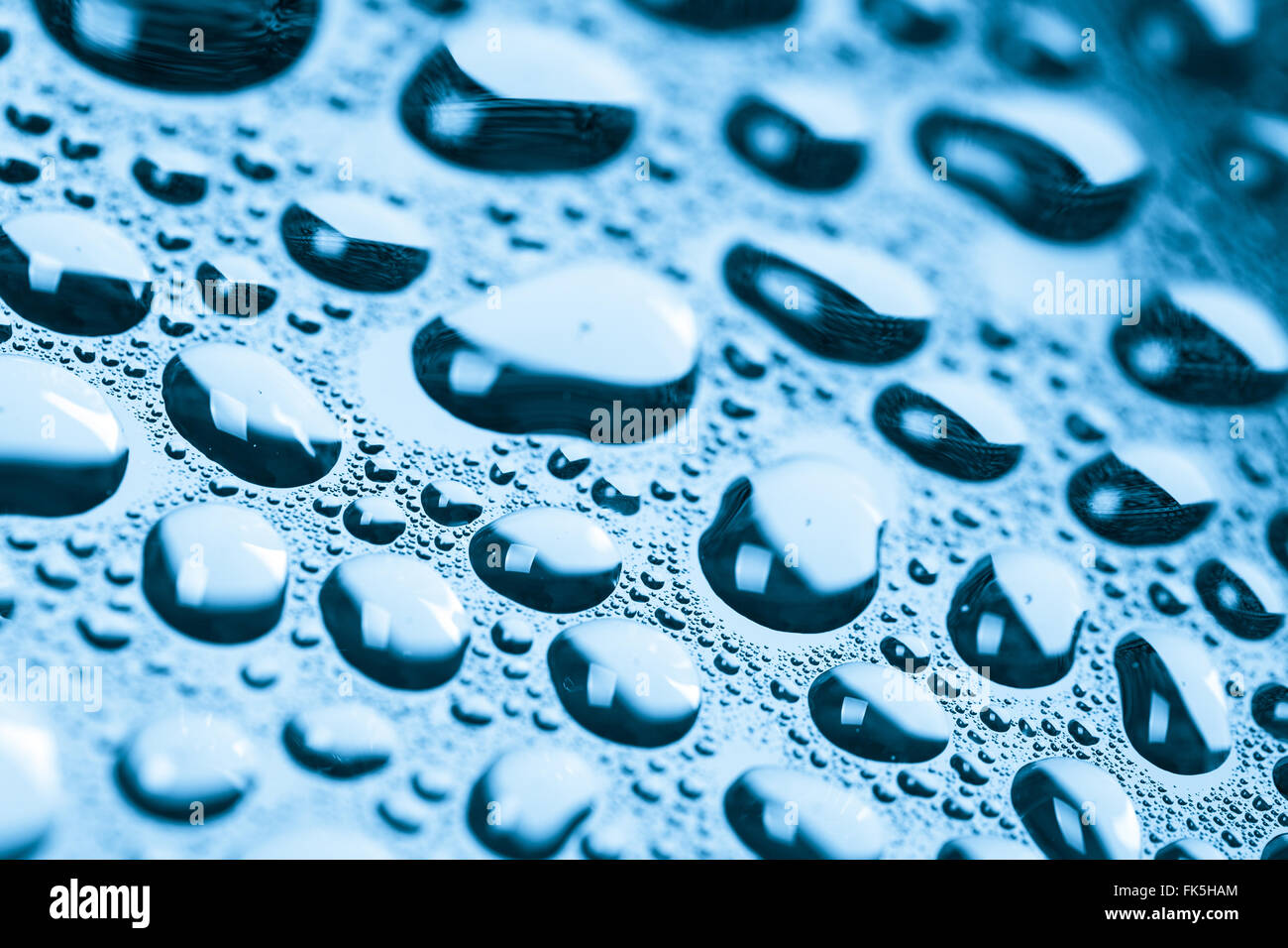 Blue water drops background Stock Photo - Alamy