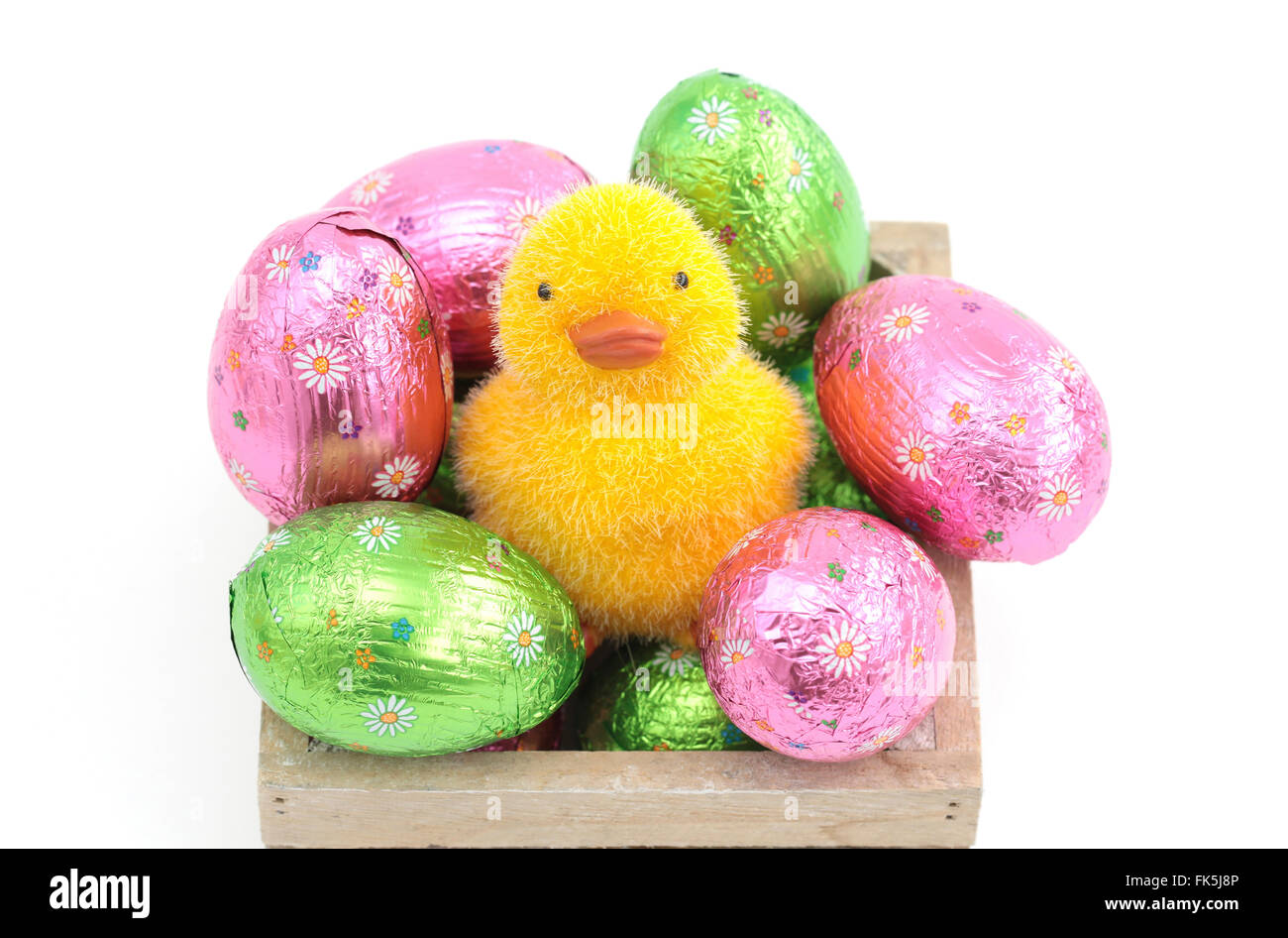 A little chicken in a box with easter eggs Stock Photo - Alamy