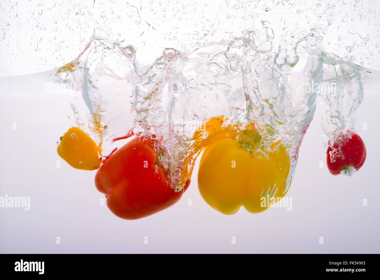 Peppers smashed into water Stock Photo - Alamy