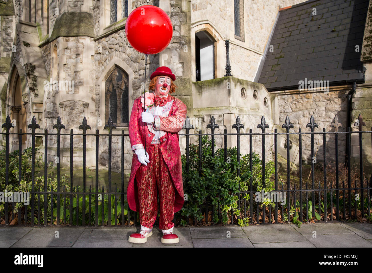 Gingernutt the Clown holds a red ballon. The 70th annual clown service ...