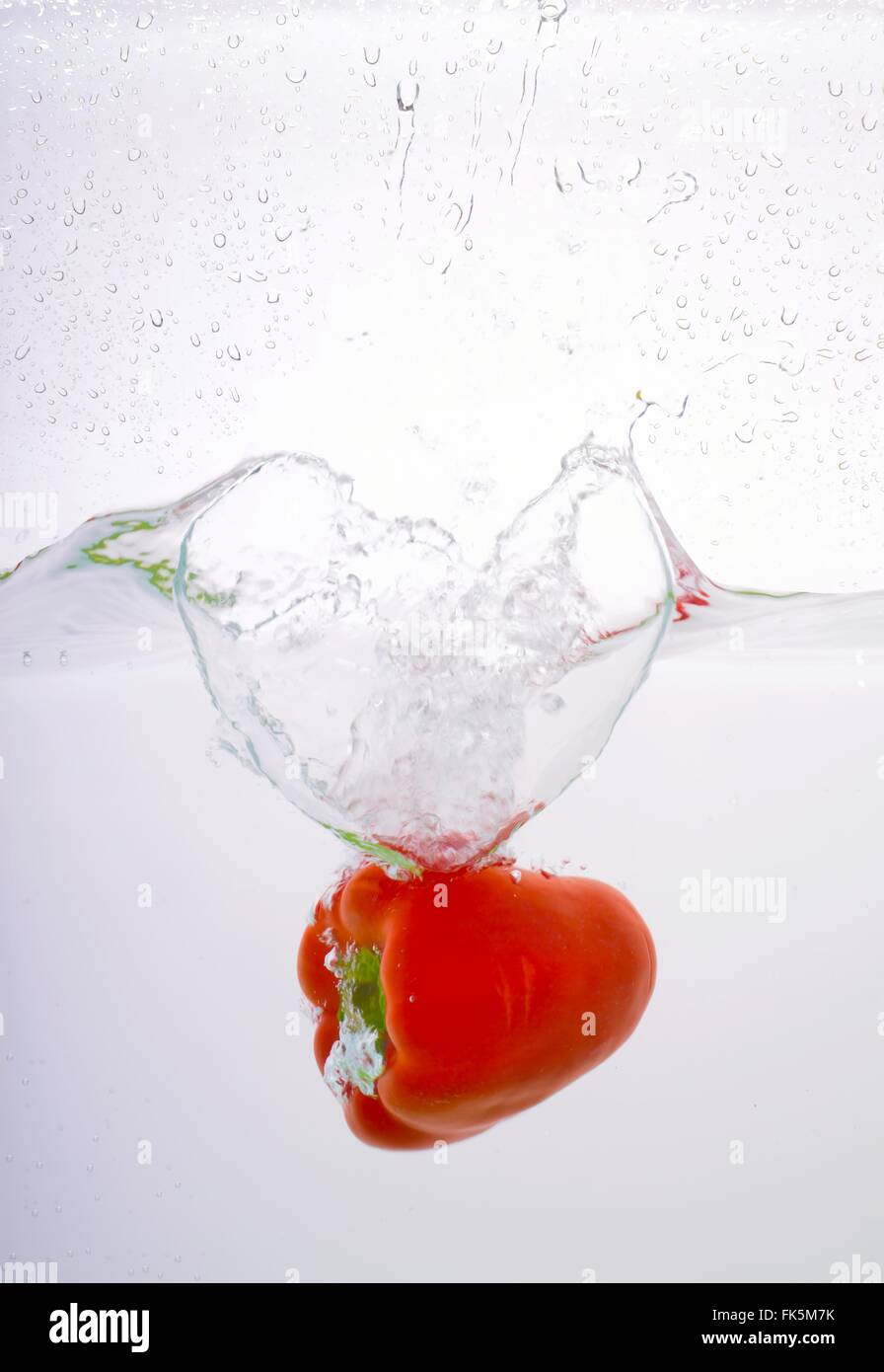 Peppers smashed into water Stock Photo - Alamy