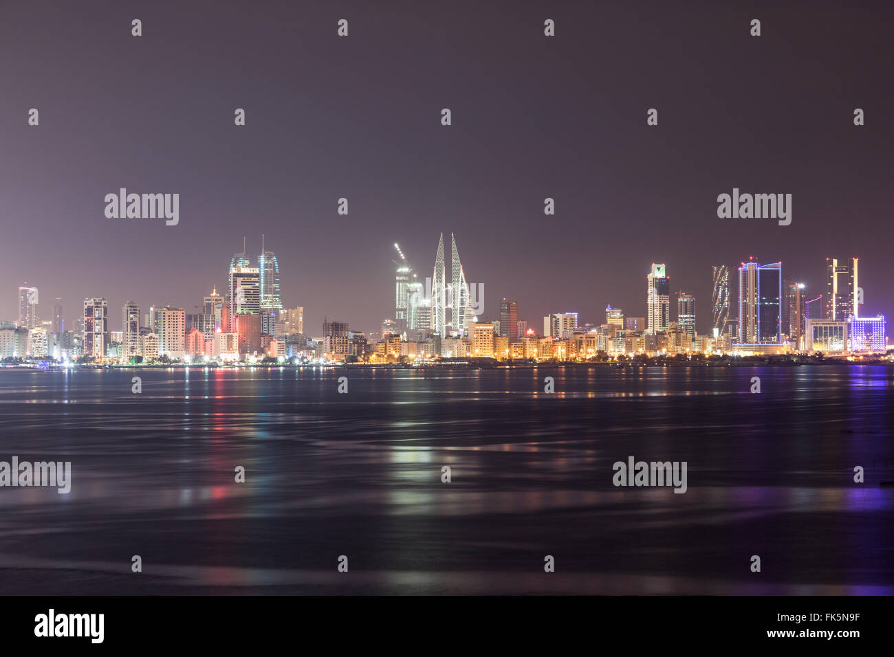 Skyline of Manama at night, Bahrain Stock Photo - Alamy