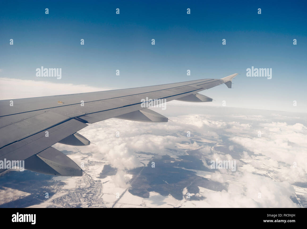Wing of aircraft seen through window Stock Photo - Alamy
