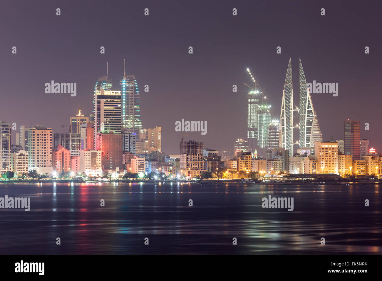 Skyline of Manama at night, Bahrain Stock Photo - Alamy