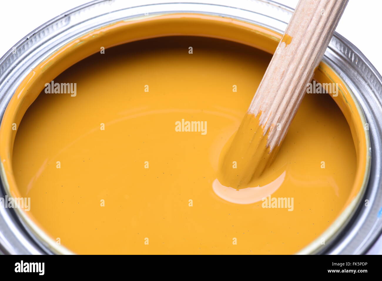 Yellow paint can Stock Photo - Alamy