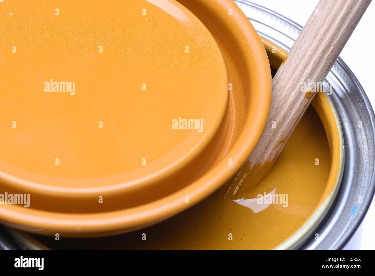 Yellow paint can Stock Photo - Alamy