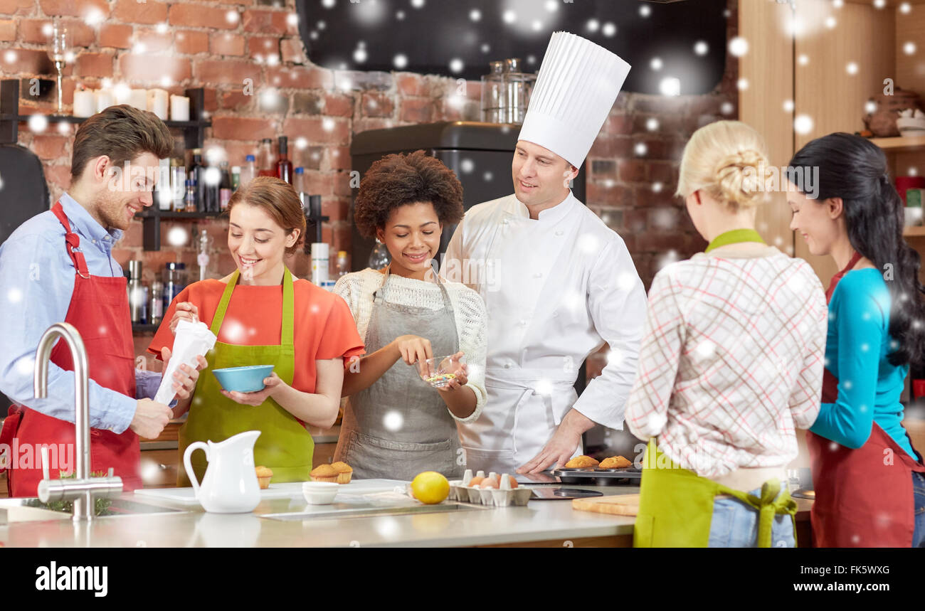 happy friends and chef cook cooking in kitchen Stock Photo - Alamy