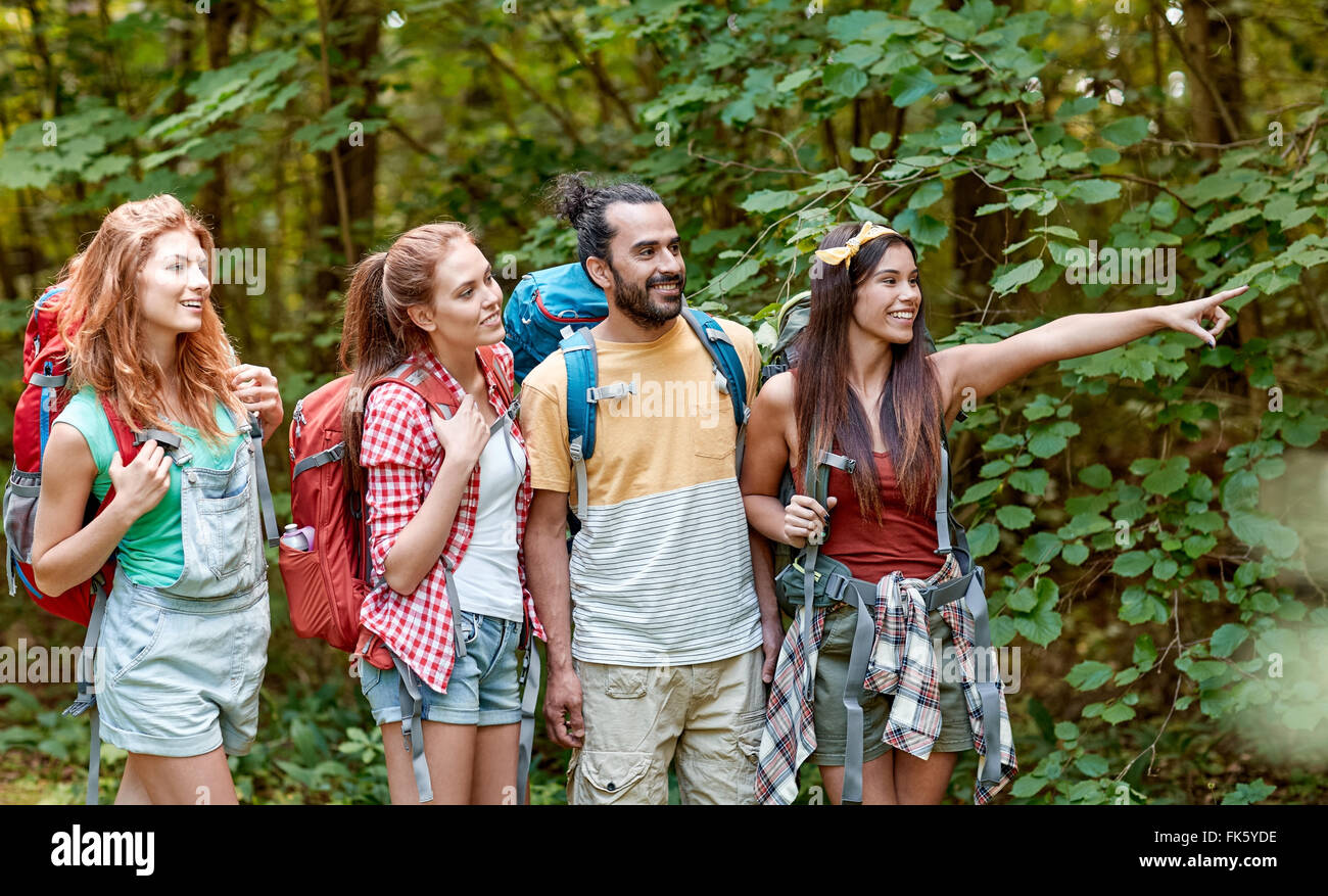group of smiling friends with backpacks hiking Stock Photo - Alamy