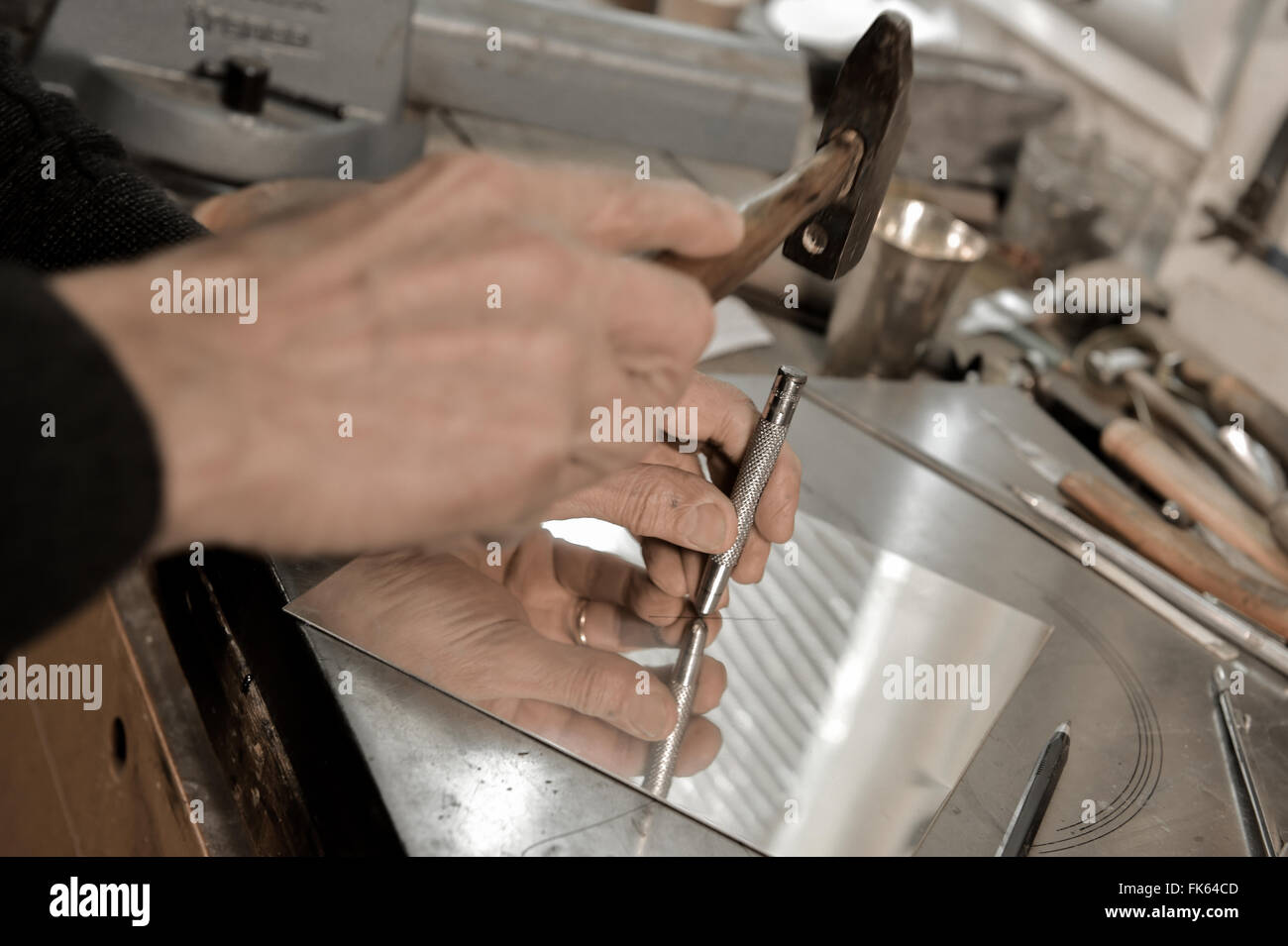 Master goldsmith working with silver-Draw a circle with a compass Stock ...