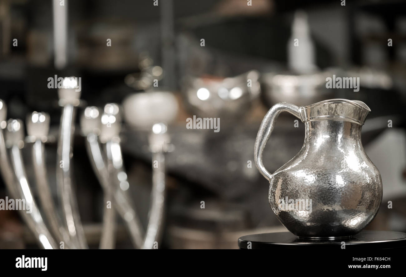 Pitcher silver in Master goldsmith workshop Stock Photo - Alamy