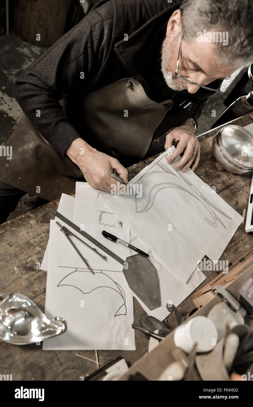 Master goldsmith working with silver-Creative drawing of a silver ...