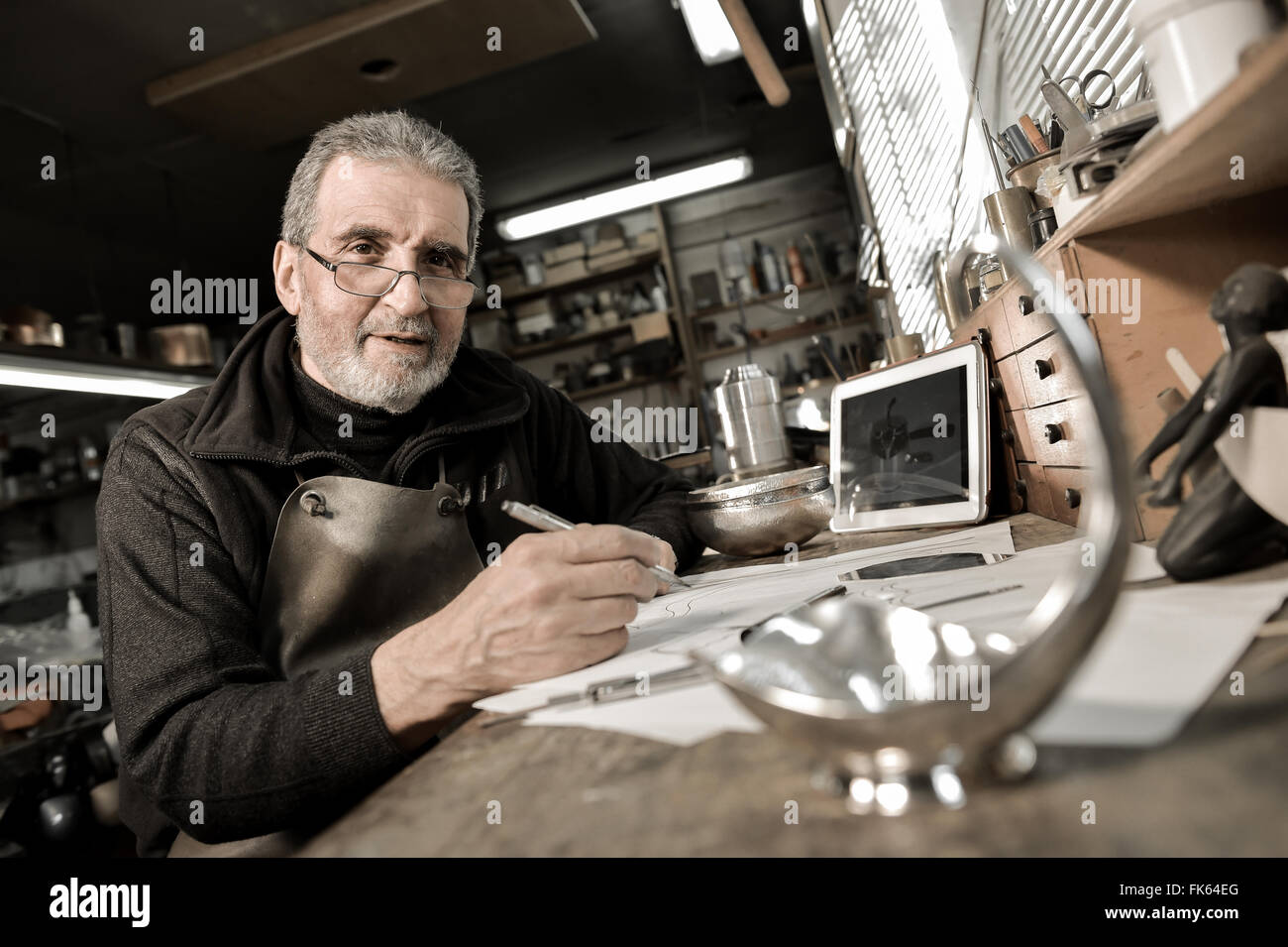 Master goldsmith working with silver-Creative drawing of a silver ...