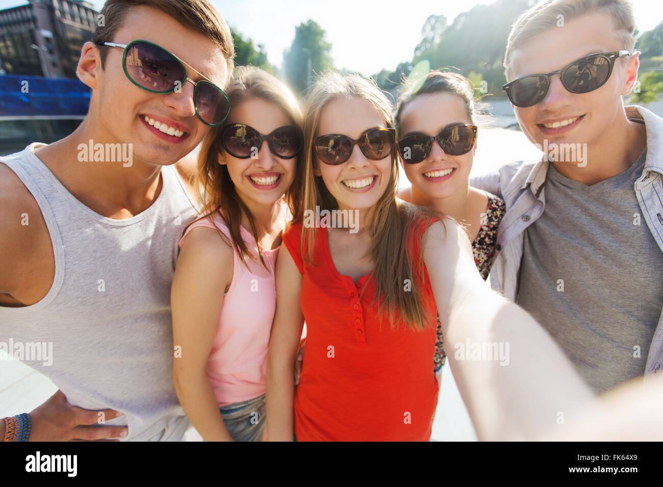 smiling friends taking selfie Stock Photo - Alamy
