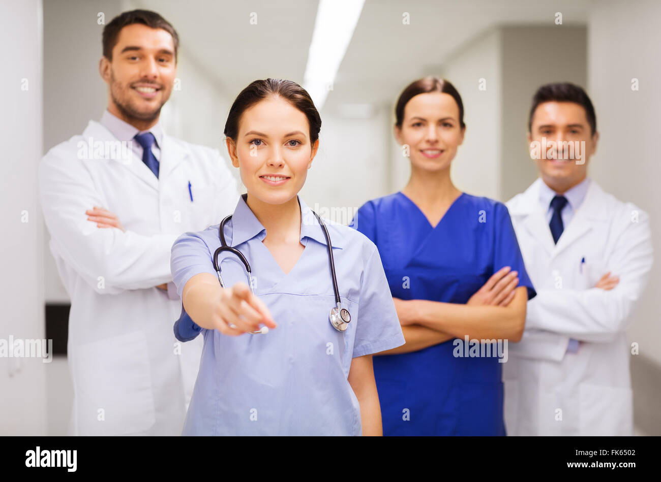 group of medics pointing finger on you at hospital Stock Photo - Alamy