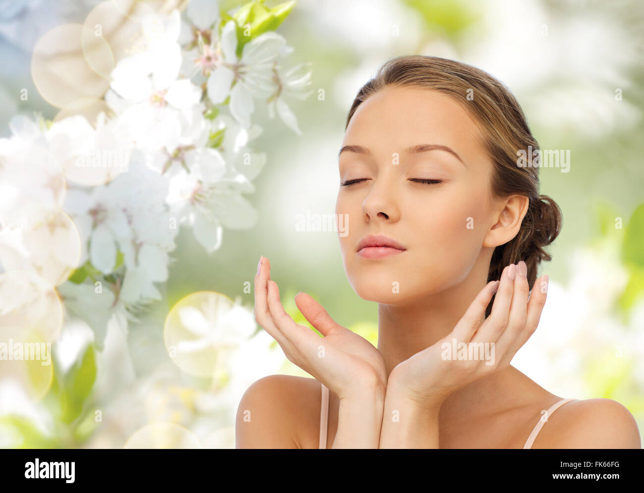 young woman face and hands Stock Photo - Alamy