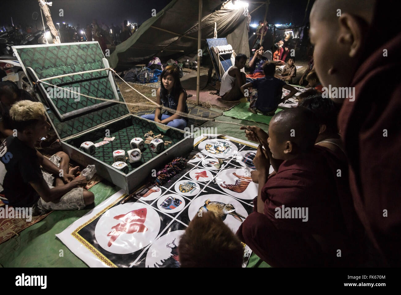 Mrauk U, monks gambling at Dung Bwe Festival for the passing of an ...