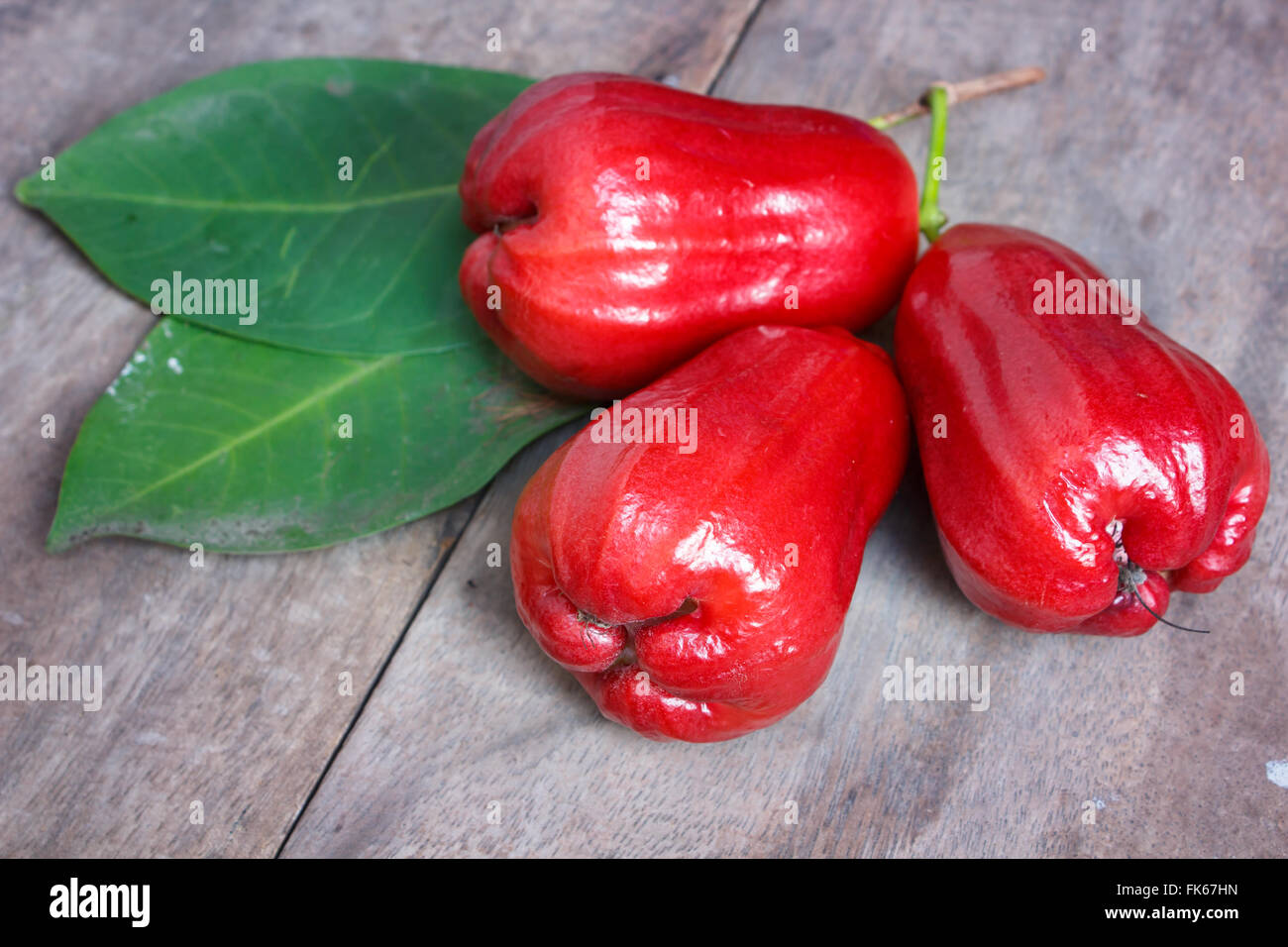 rose apple on old wood, still life Stock Photo - Alamy