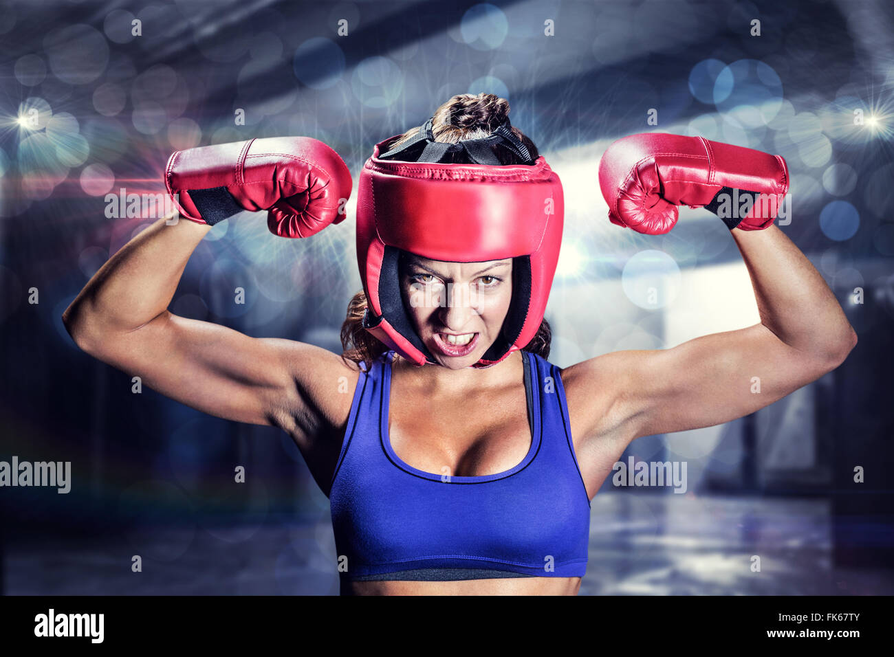 Composite image of portrait of angry female boxer flexing muscles Stock ...