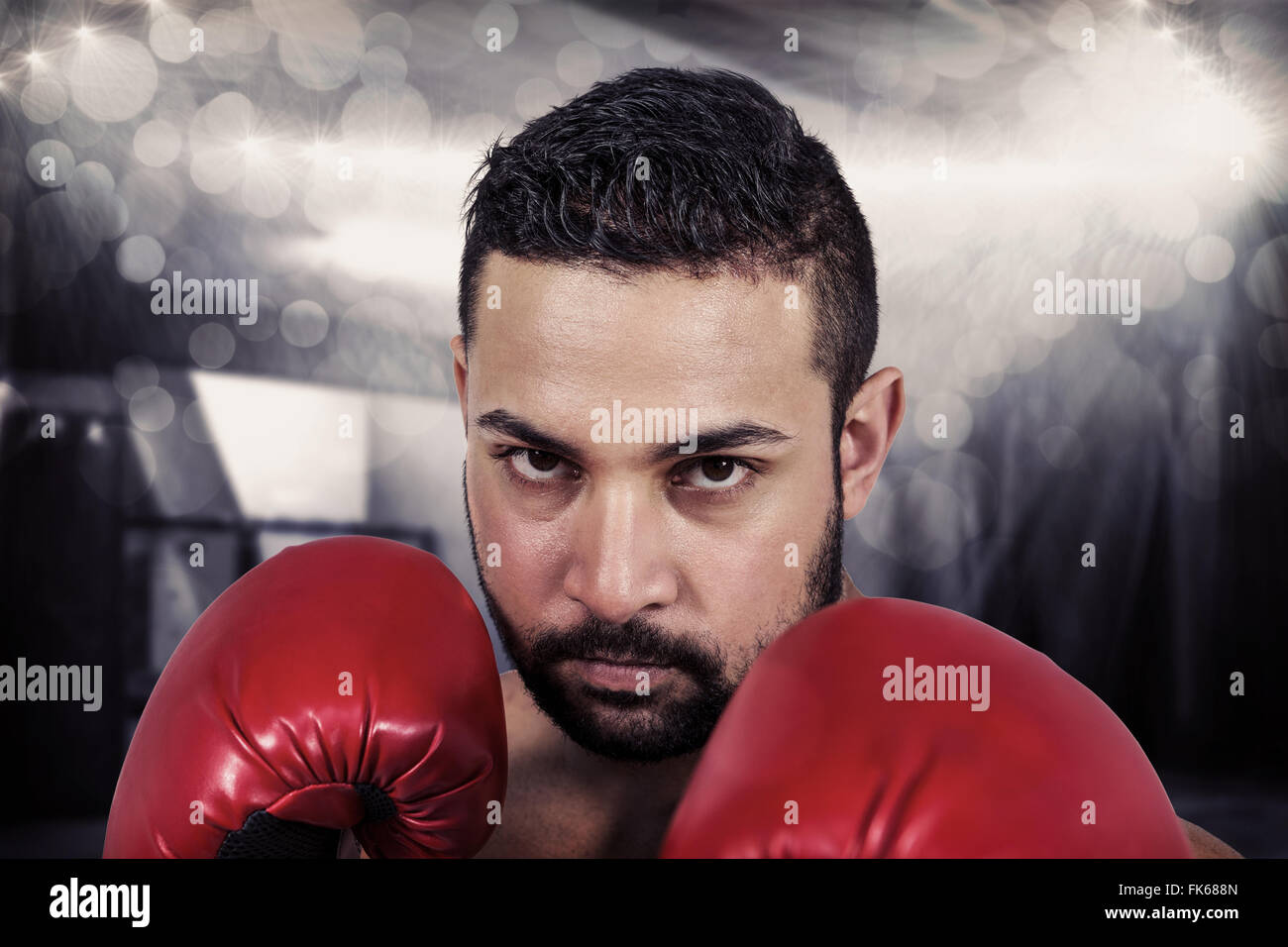 Composite image of muscular man boxing in gloves Stock Photo - Alamy