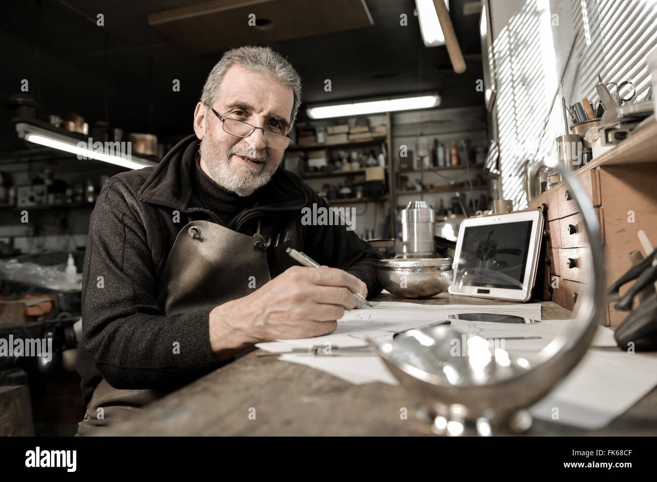 Master goldsmith working with silver-Creative drawing of a silver ...