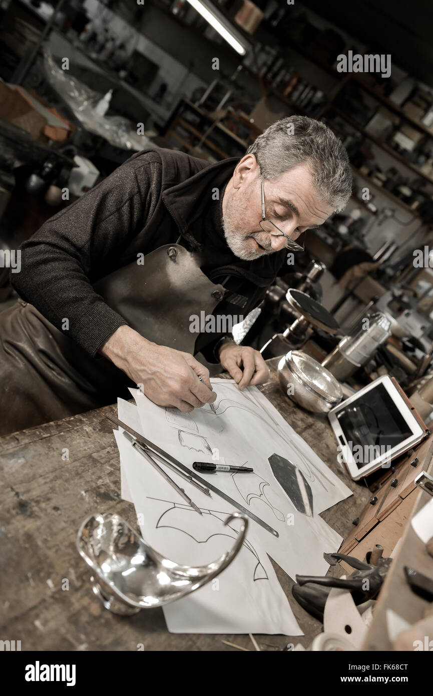 Master goldsmith working with silver-Creative drawing of a silver ...