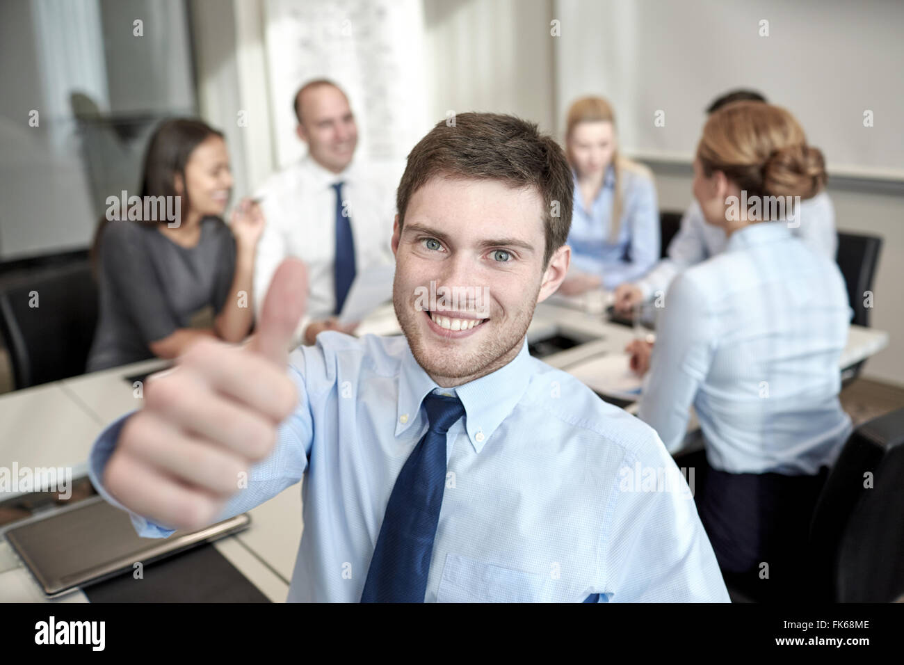 group of smiling businesspeople meeting in office Stock Photo - Alamy