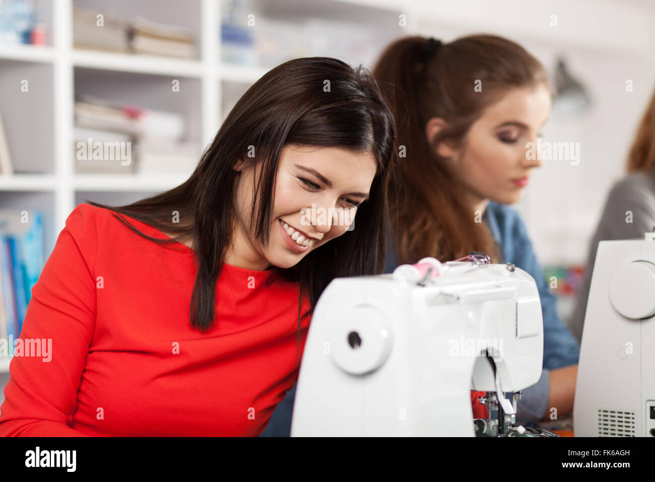 Beautiful woman sewing hi-res stock photography and images - Alamy