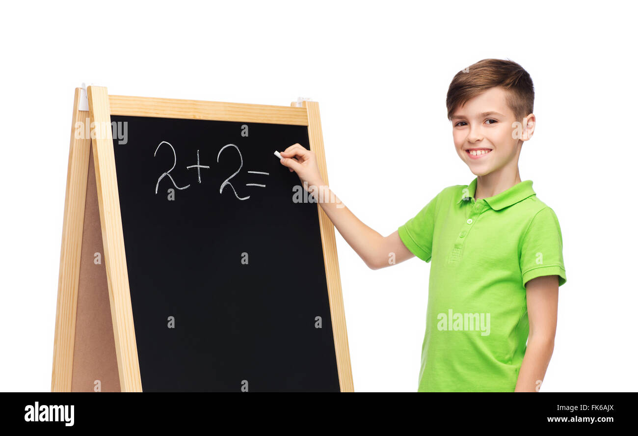 happy boy solving math on school blackboard Stock Photo - Alamy
