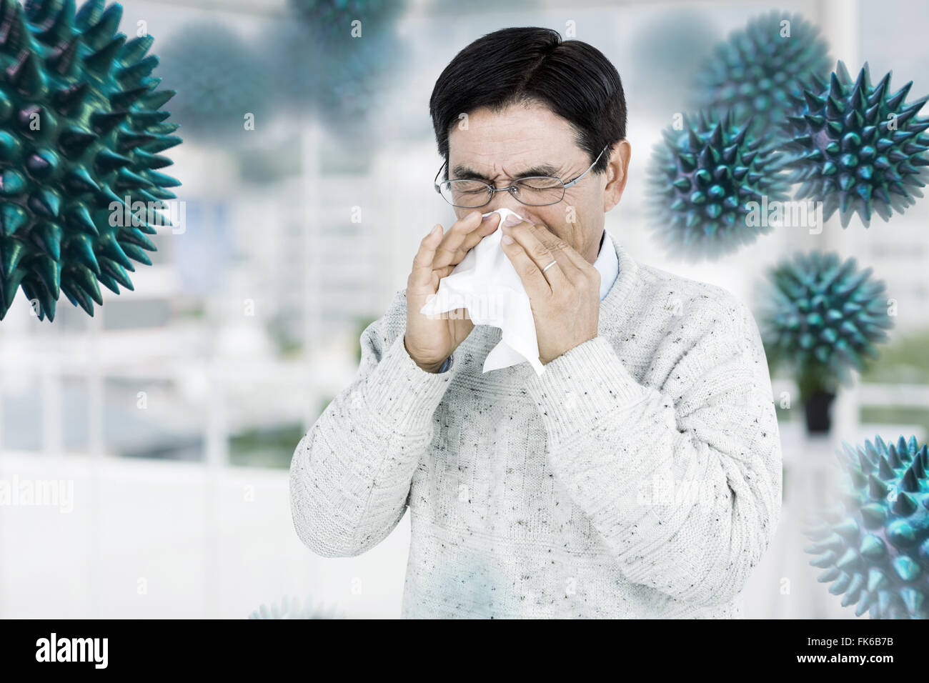 Composite image of smiling man using a tissue Stock Photo - Alamy