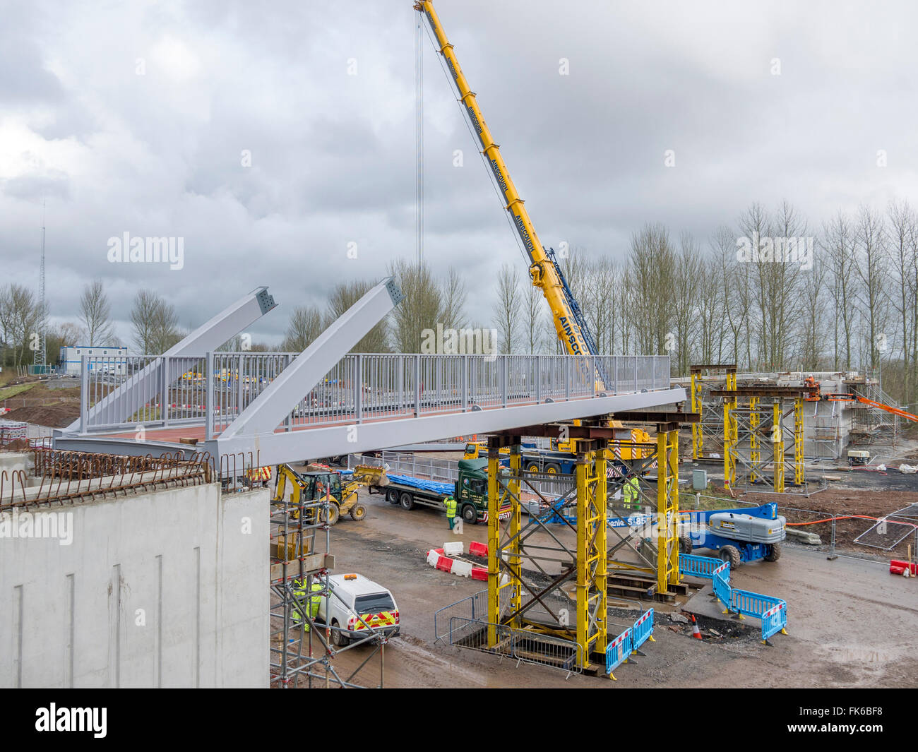 Building of a new footbridge, with construction crane and construction ...