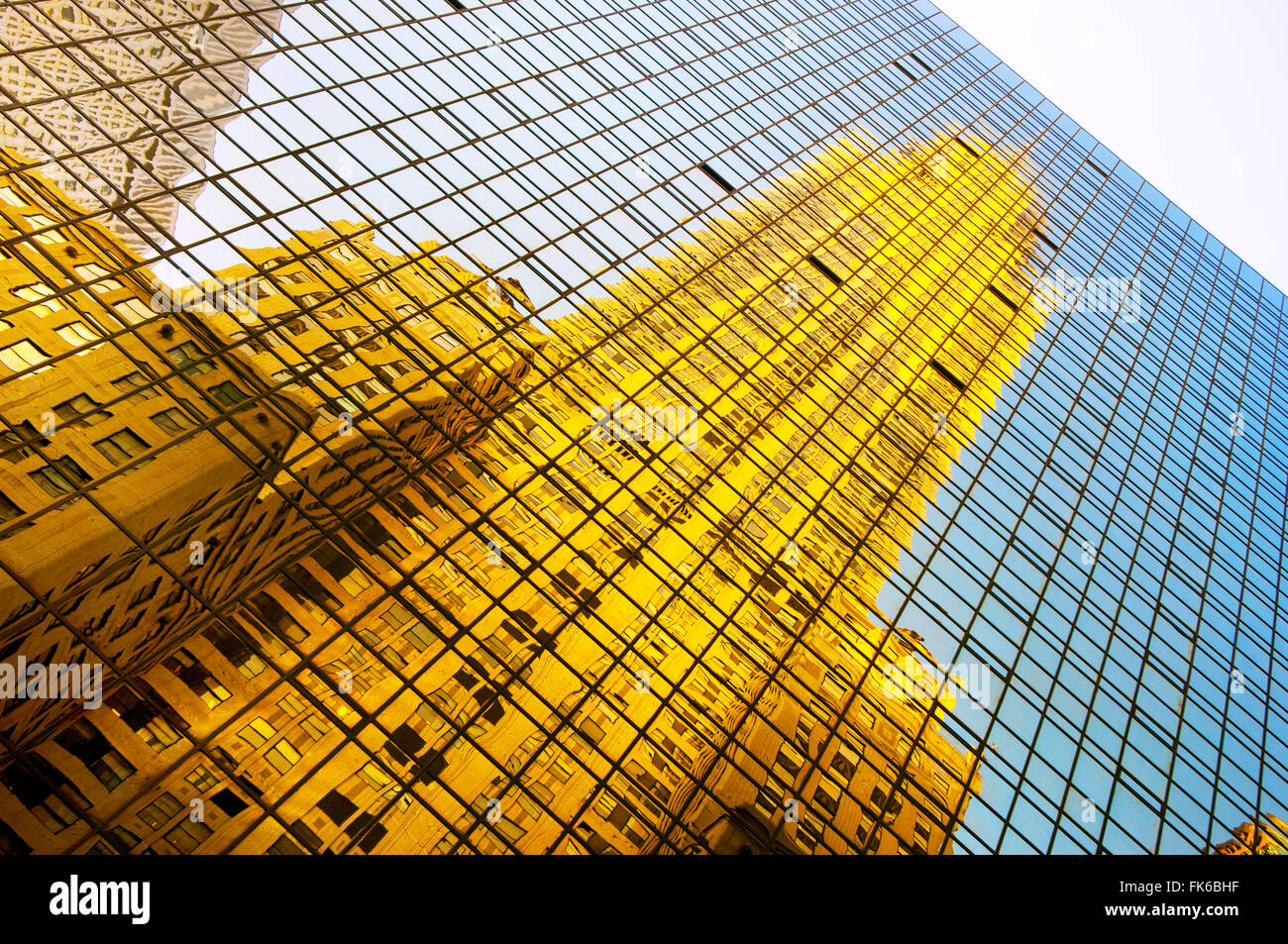 The Chrysler Building reflected in modern glass skyscraper, Lexington ...