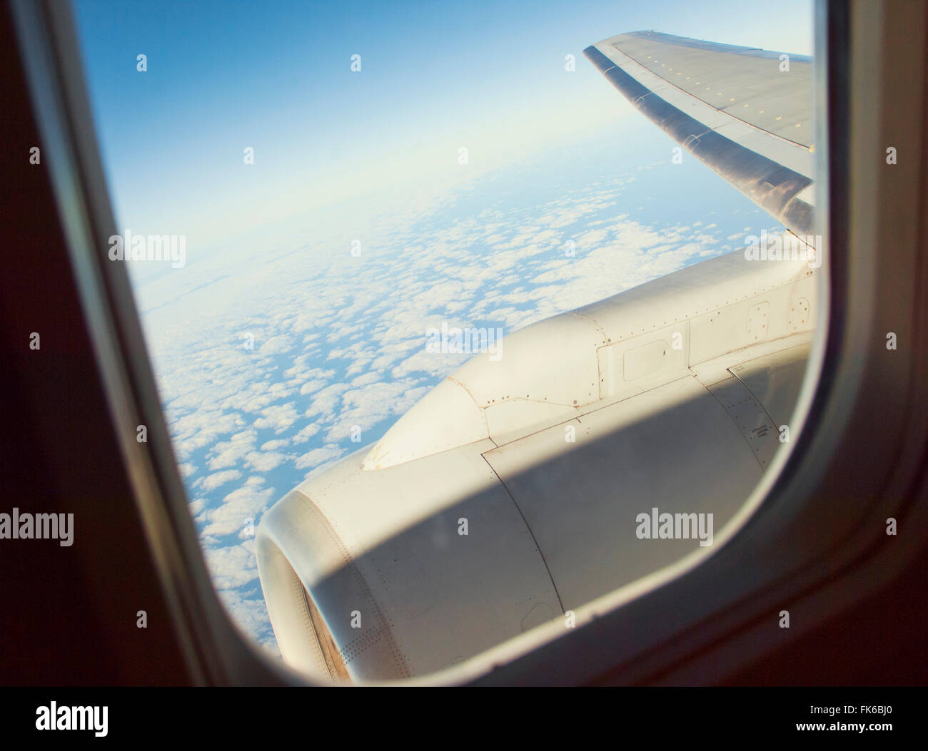 View above the clouds from a plane window, United States of America ...