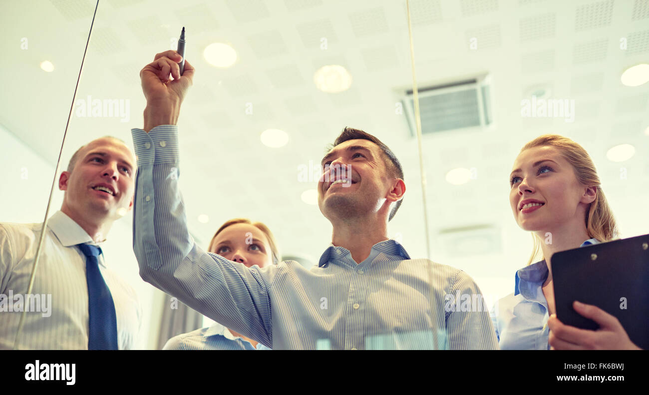 smiling business people with marker and stickers Stock Photo - Alamy