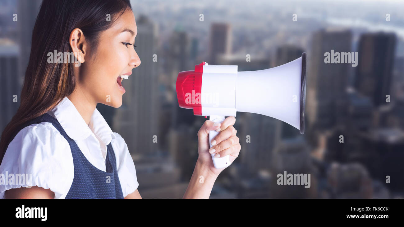 Composite image of businesswoman shooting through a megaphone Stock ...