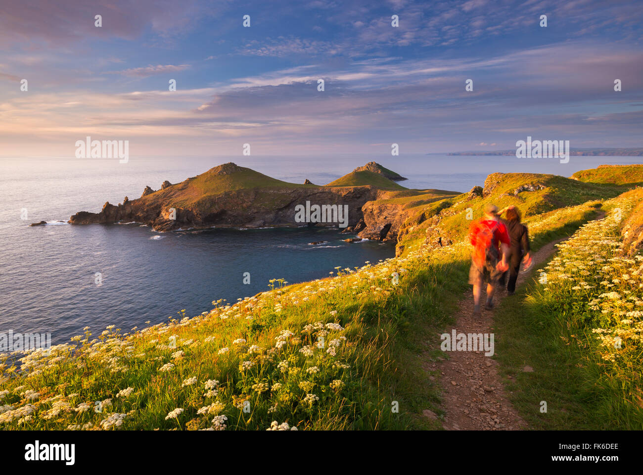 Walkers on the South West Coast Path on Pentire Head, overlooking The ...