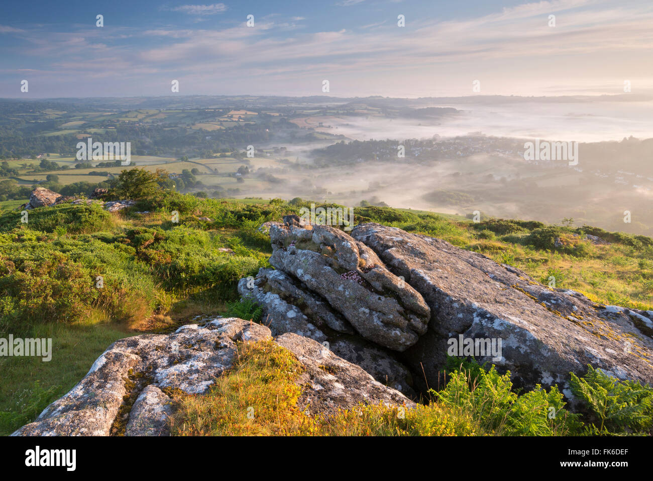Mist covered village of Chagford & rolling countryside from Meldon Hill ...