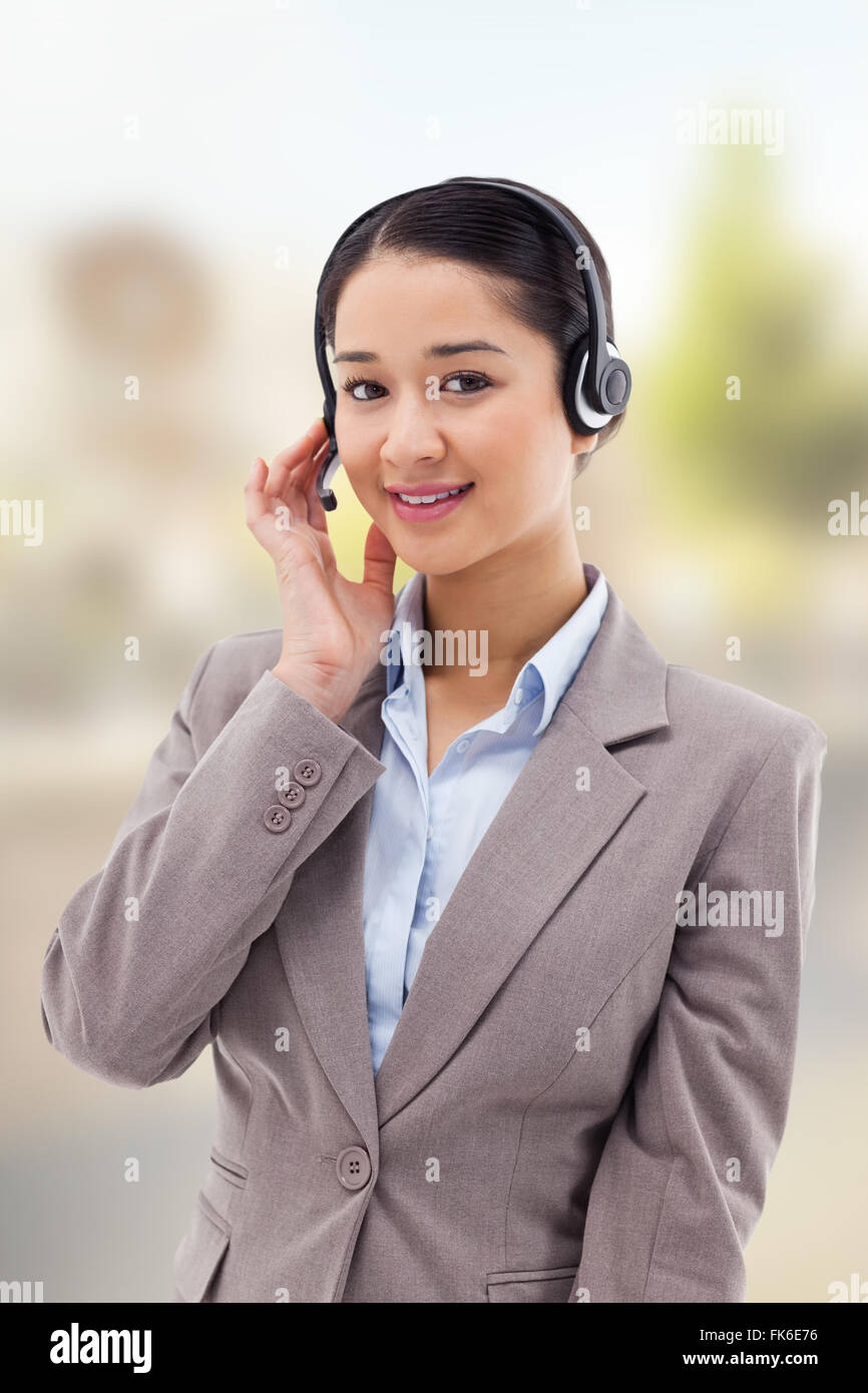 Composite image of portrait of a good looking operator posing with a ...