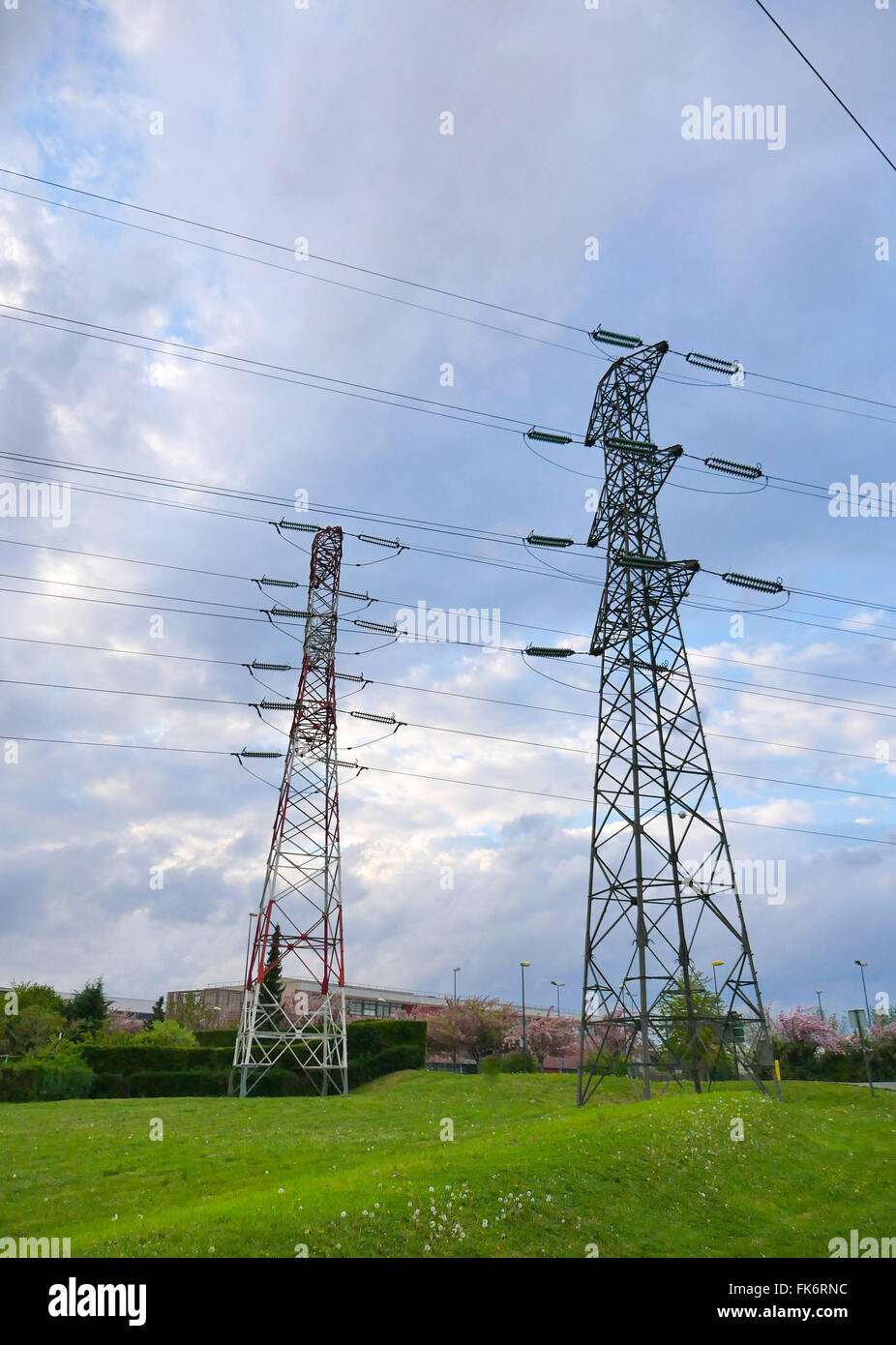 Power lines in sunny rural field Stock Photo - Alamy