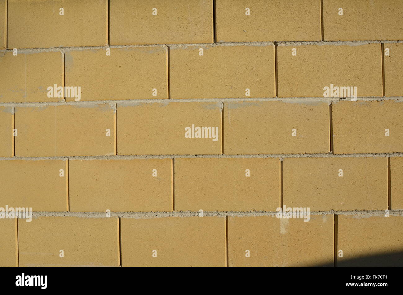 Yellow brick wall Stock Photo - Alamy
