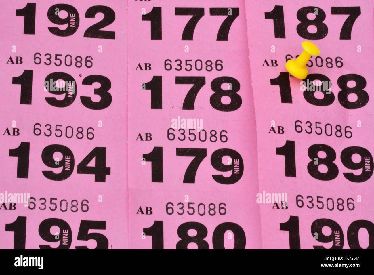 rows of raffle tickets with winner highlighted Stock Photo - Alamy
