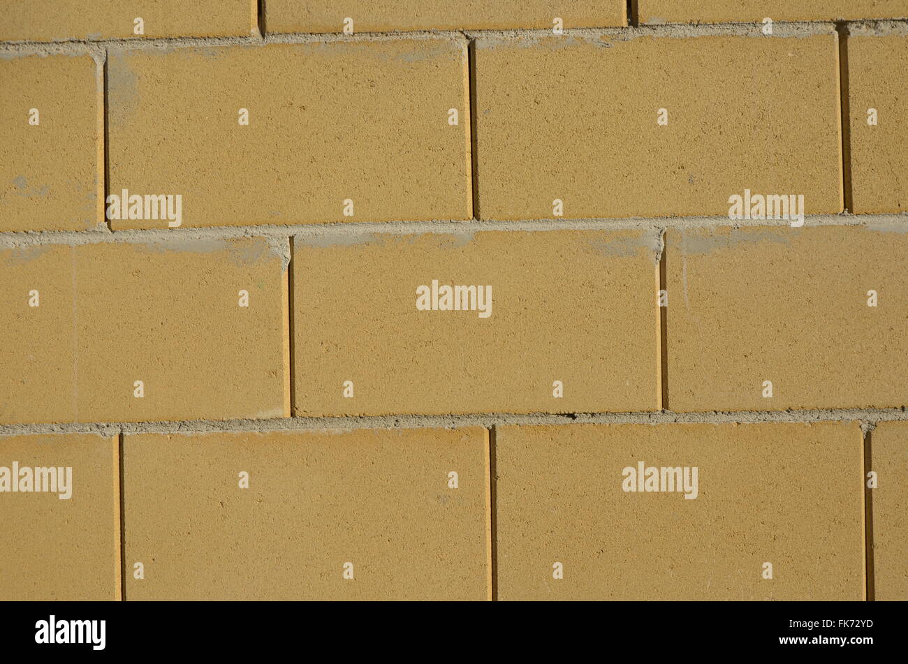Yellow brick wall Stock Photo - Alamy