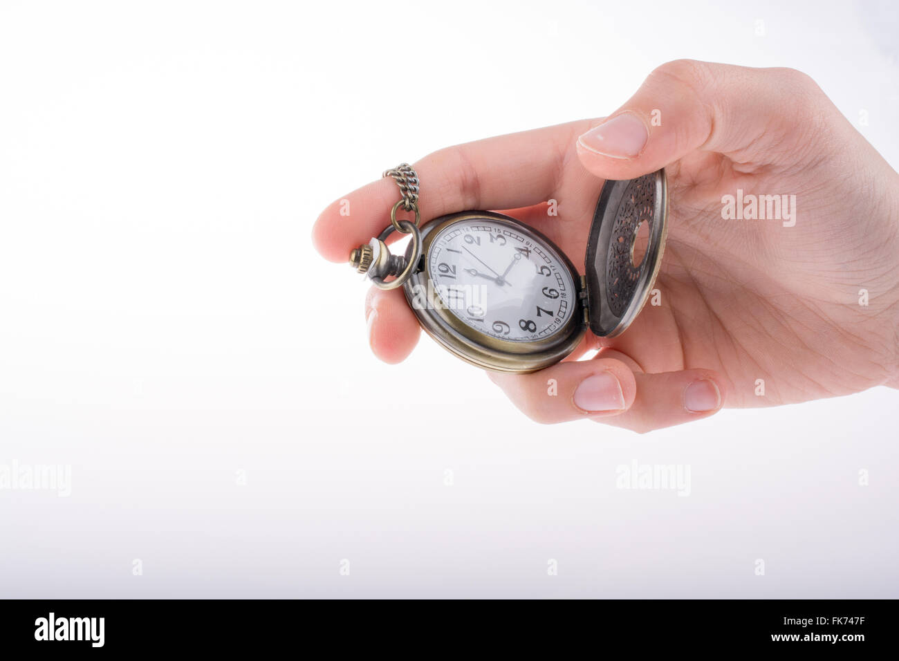 Hand holding a retro styled pocket watch in hand Stock Photo - Alamy
