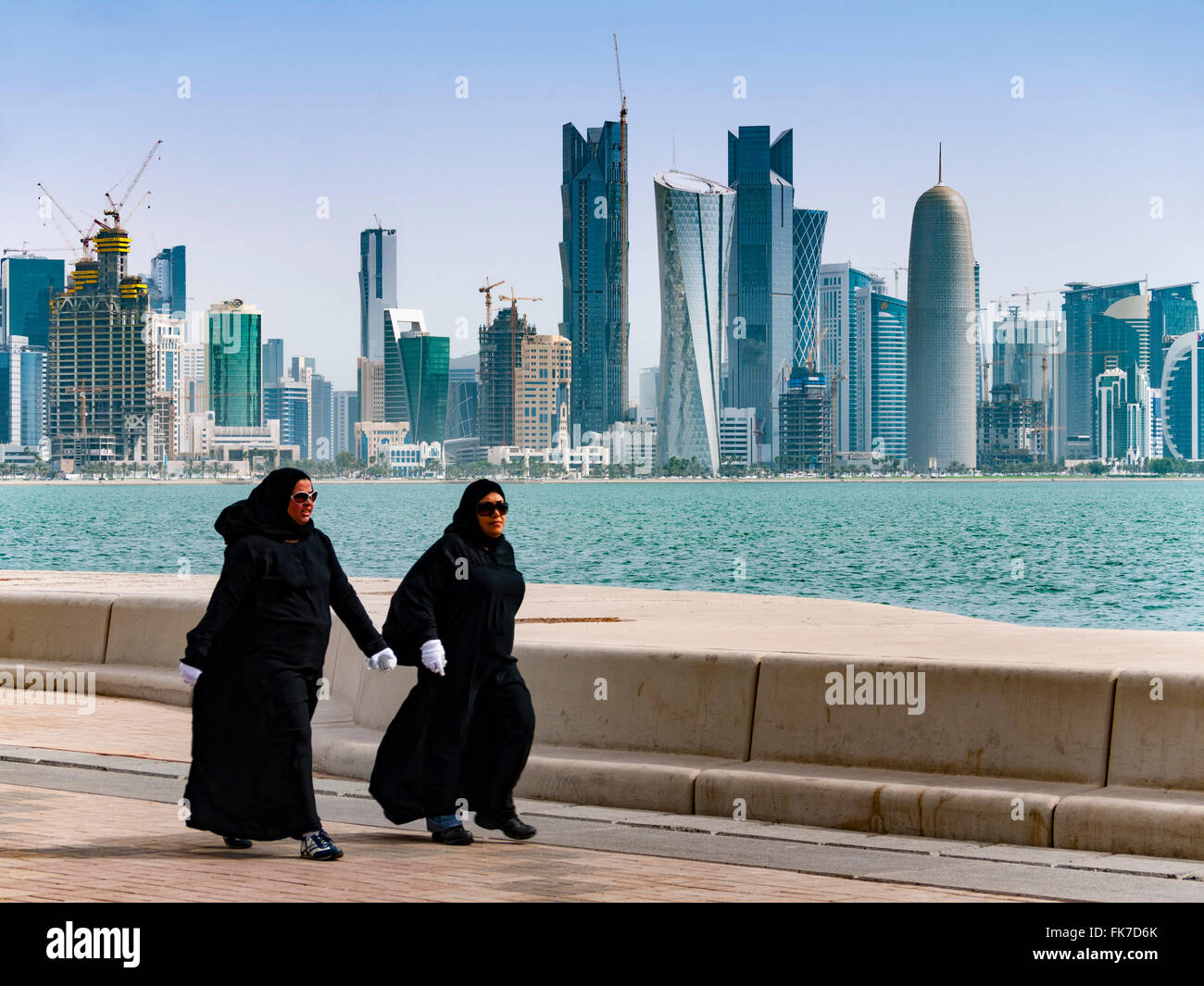 View along waterfront of Corniche towards modern office towers in Doha ...