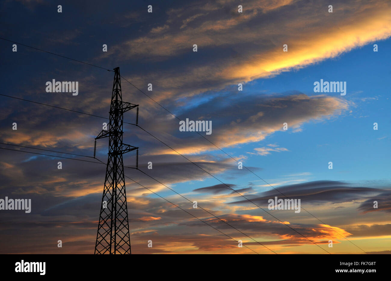 Electric pole power lines and wires at sunset Stock Photo - Alamy