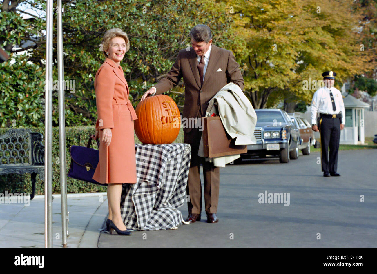 U.S. President Ronald Reagan and First Lady Nancy Reagan stand next to ...