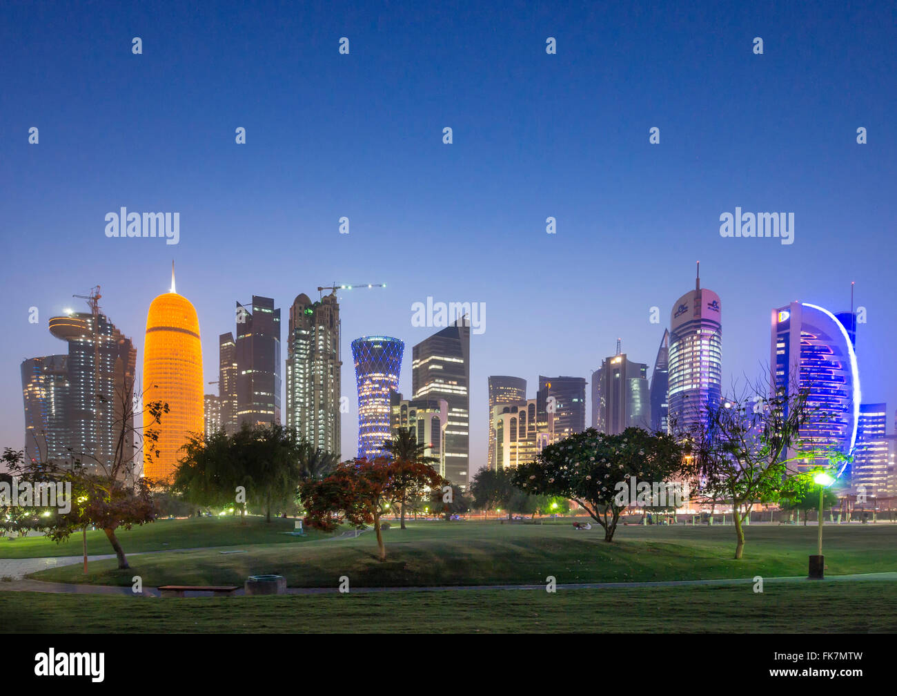 Night view of skyline along Corniche towards modern office towers in ...