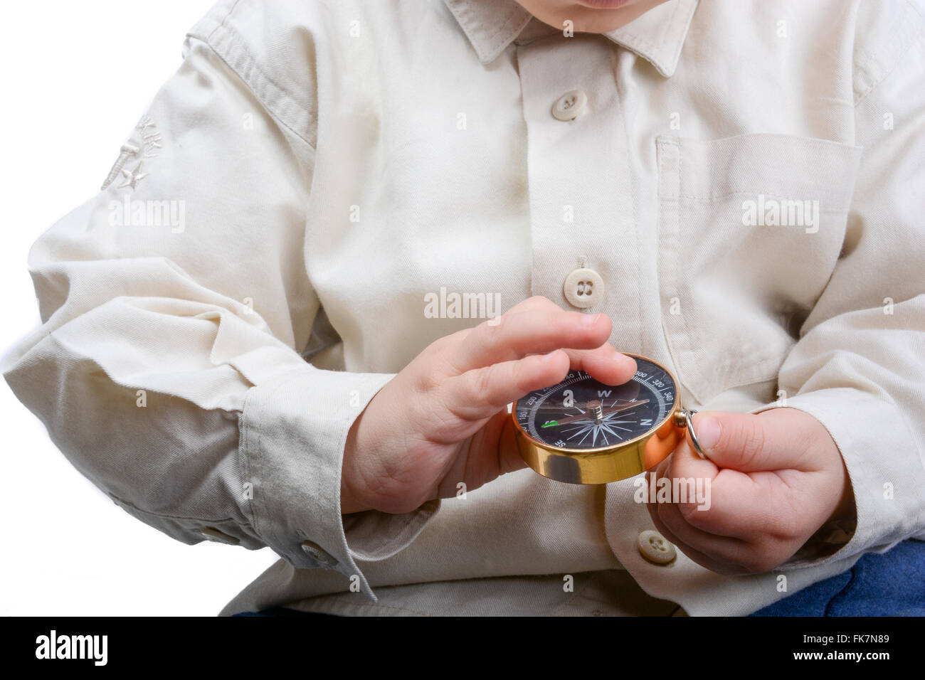 Isolated compass in baby's hand on a white background Stock Photo - Alamy