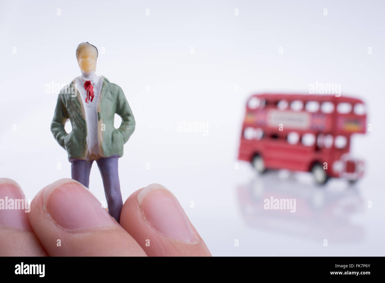 Human figure near a London Bus on a white background Stock Photo - Alamy